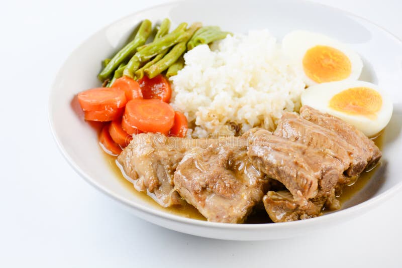 Baked pork ribs with rice stock image. Image of board - 156292201