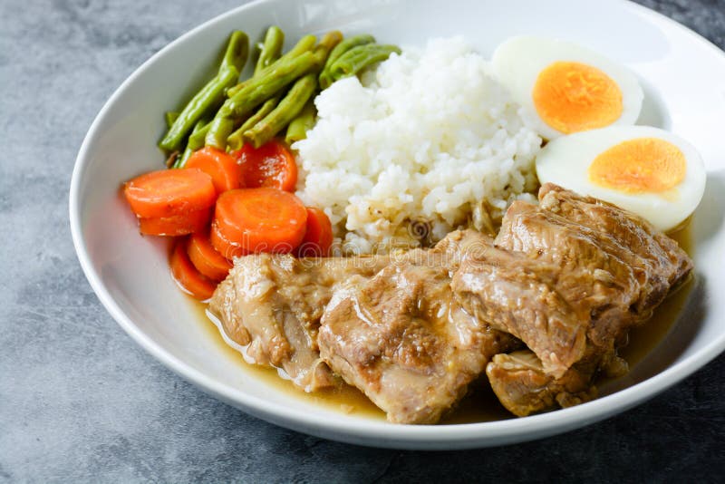 Baked pork ribs with rice stock image. Image of food - 156329545