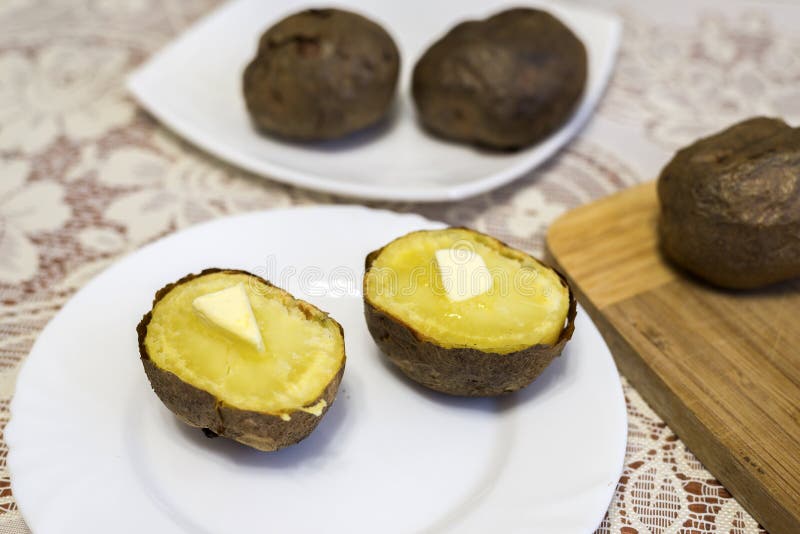 Baked Potatoes Cut into Halves on Table Stock Image - Image of potato ...