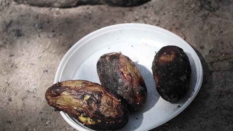 Baked Potatoes Over Charcoal on a Fire, Fried Potatoes Over a Fire ...