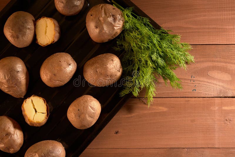 Baked potatoes on a table stock image. Image of spicy - 78231665