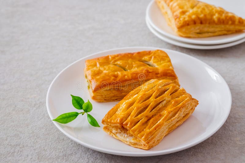 Baked Puff Pastry on White Plate Stock Photo - Image of snack, lunch ...