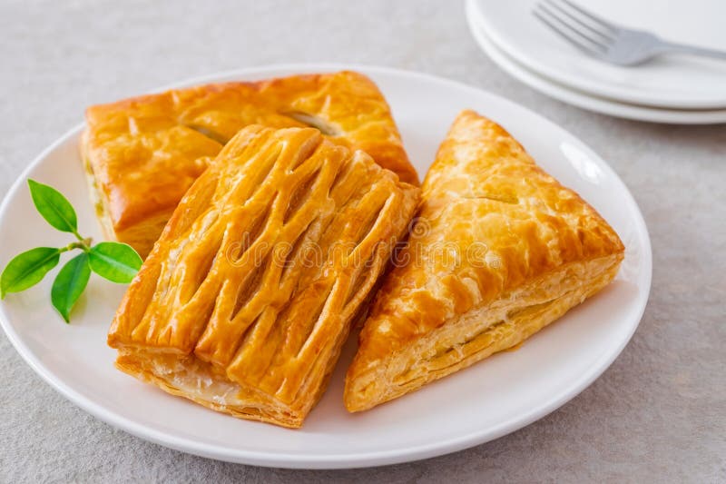 Baked Puff Pastry on White Plate Stock Photo - Image of food, bread ...