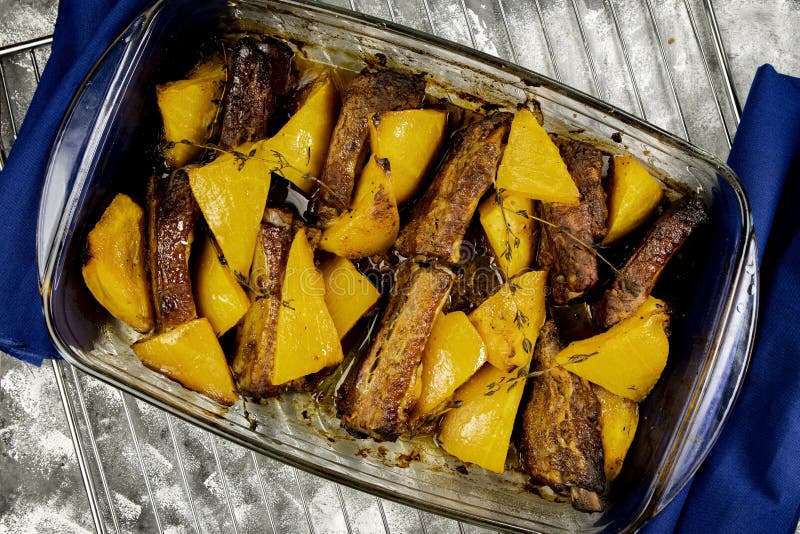 Baked Pumpkin with Pork Ribs in a Glass Pan, Top View Stock Photo ...