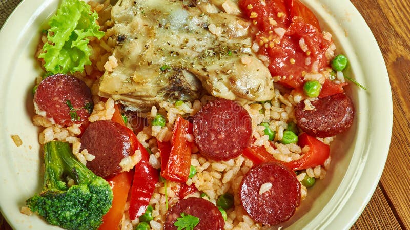 Baked rabbit chorizo rice stock image. Image of yellow - 182337023