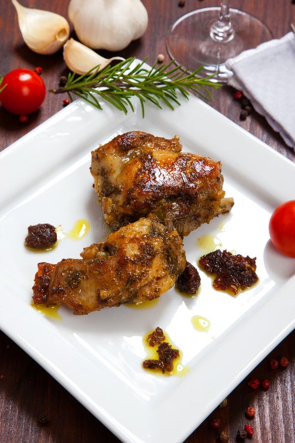 Baked Rabbit with Tomatoes in a Dish Stock Photo - Image of recipe ...