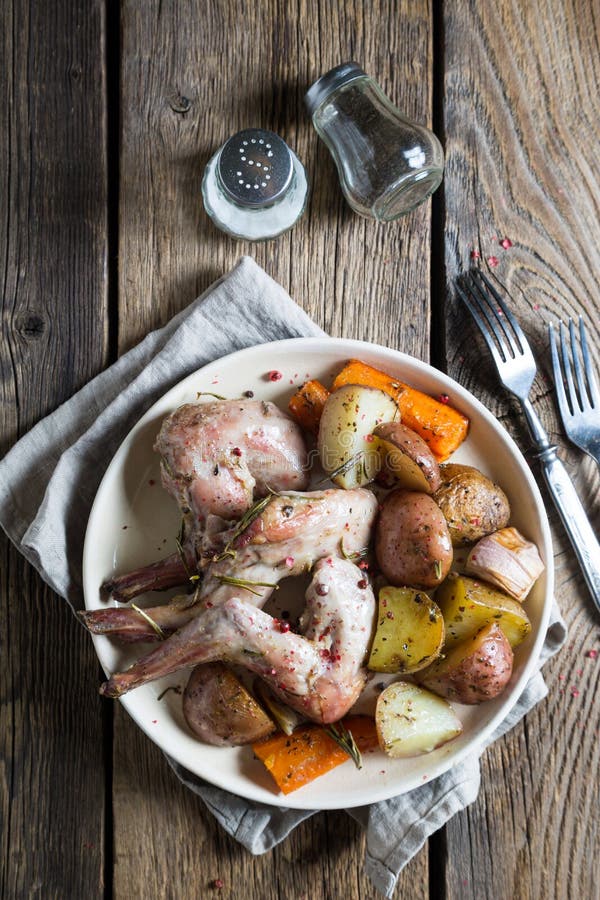 Baked Rabbit with Vegetables Stock Image - Image of spatula, table ...