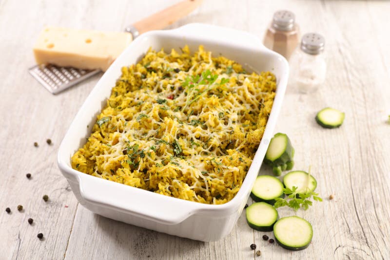 Baked rice and zucchini stock photo. Image of cooked - 130975746