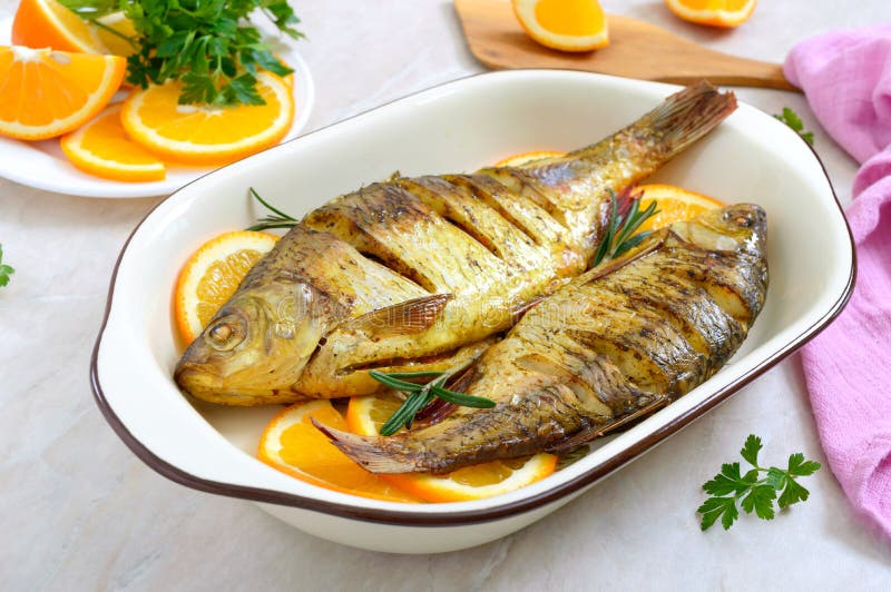 Baked Roach Fish with Vegetables and Oranges in a Ceramic Bowl. Diet ...