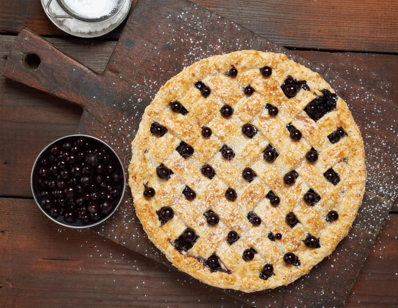 Baked Round Black Currant Pie on Wooden Background Stock Photo - Image ...