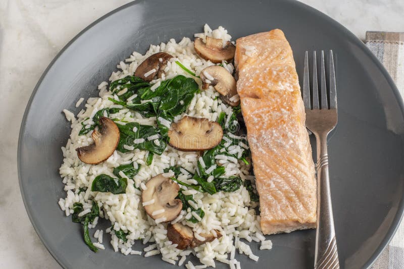 Baked Salmon with Rice Spimch and Mushrooms Stock Photo - Image of ...