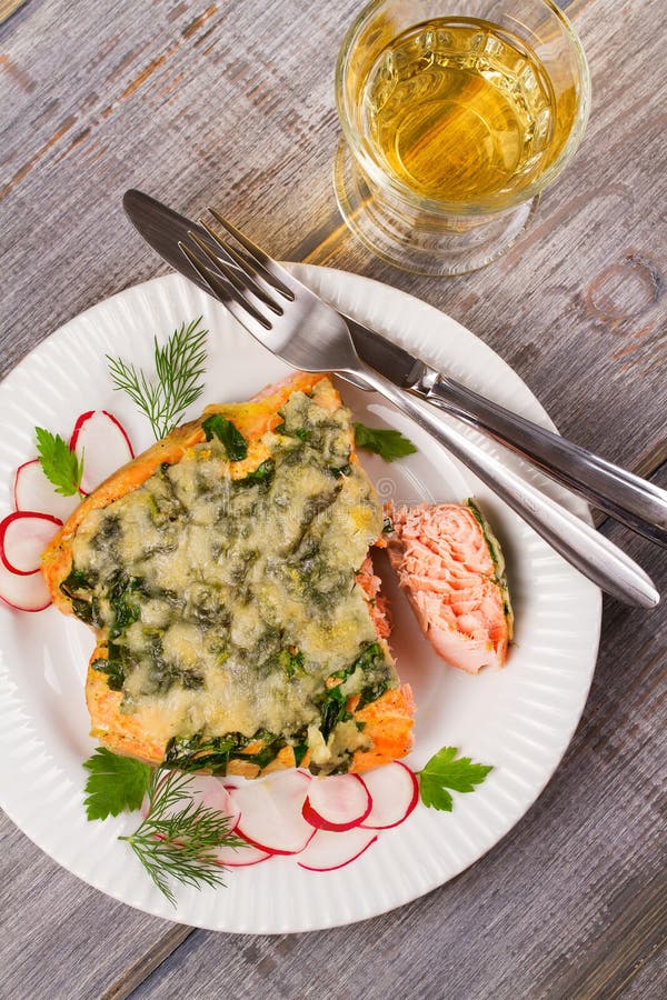Baked Salmon with Spinach and Cheese. Fish on White Plate Stock Image ...