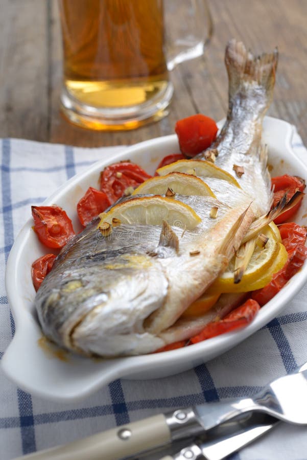 Baked Sea Bream with Vegetables Stock Image - Image of food, table ...