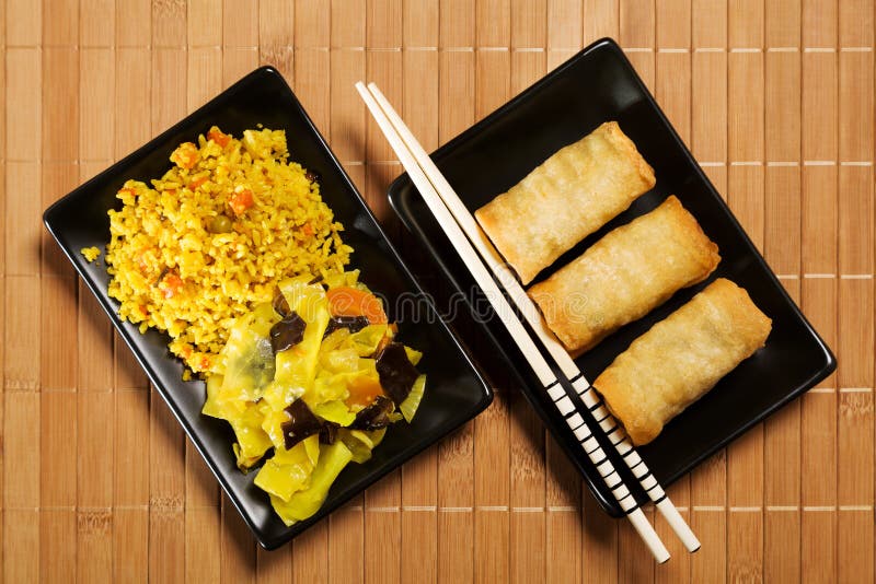 Baked Spring Rolls with Vegetables on a Black Plate Stock Photo - Image ...