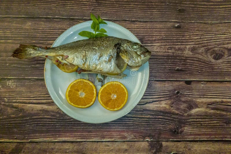 Baked Stuffed Dorada, with Orange Slices Stock Image - Image of dorada ...