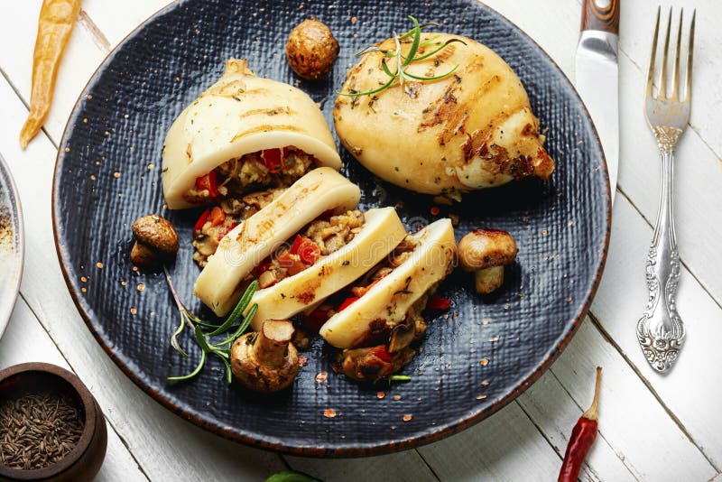 Baked squid on the plate stock photo. Image of mushrooms - 277886932