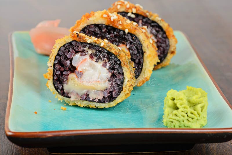 Baked Sushi Rolls Served on Blue Plate Stock Image - Image of baked ...