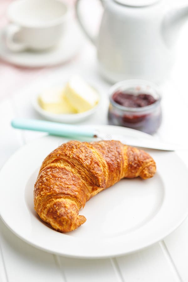 Baked Tasty Croissant on Plate on White Table Stock Image - Image of ...