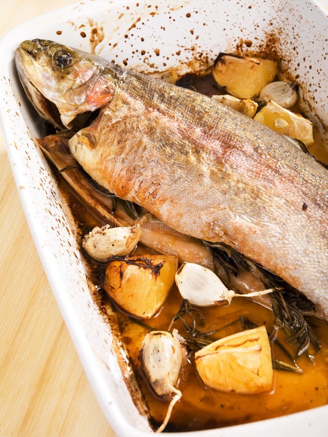 Baked trout with garlic stock photo. Image of drink, meal - 49319758