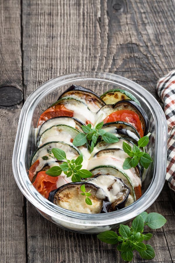 Baked Vegetables with Cheese and Greek Basil on Wooden Table Stock ...