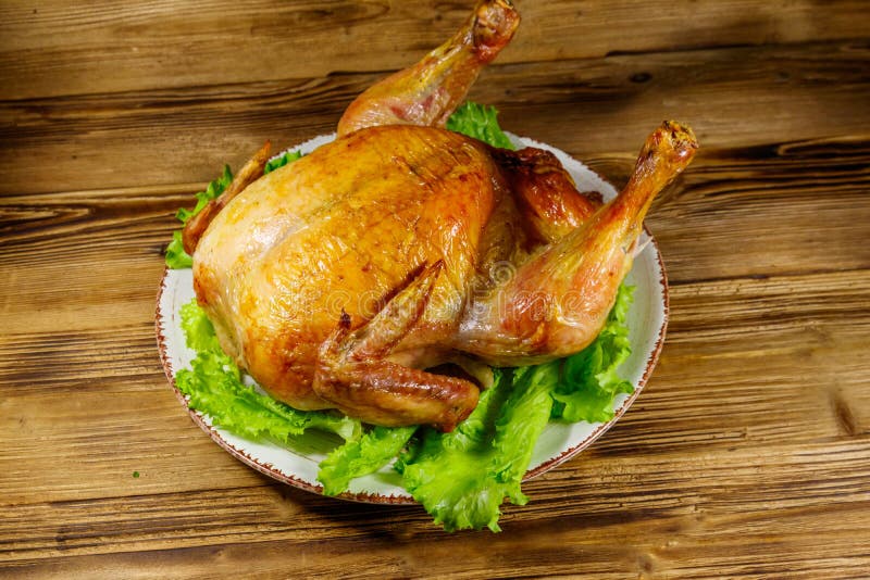 Baked Whole Chicken on Wooden Table Stock Image - Image of homemade ...