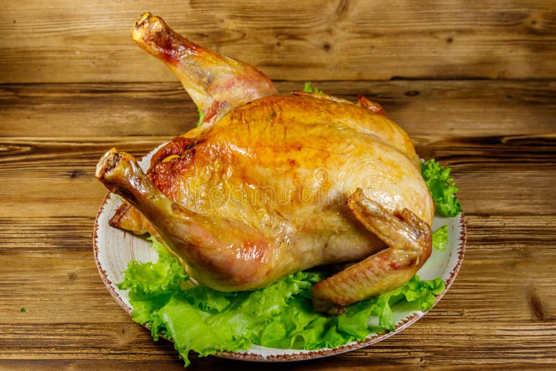 Baked Whole Chicken on Wooden Table Stock Image - Image of dinner ...