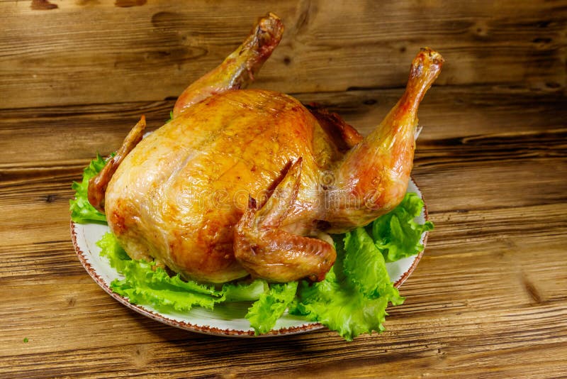 Baked Whole Chicken on Wooden Table Stock Photo - Image of juicy, baked ...