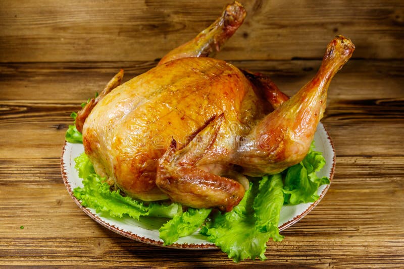 Baked Whole Chicken on Wooden Table Stock Photo - Image of juicy, fried ...