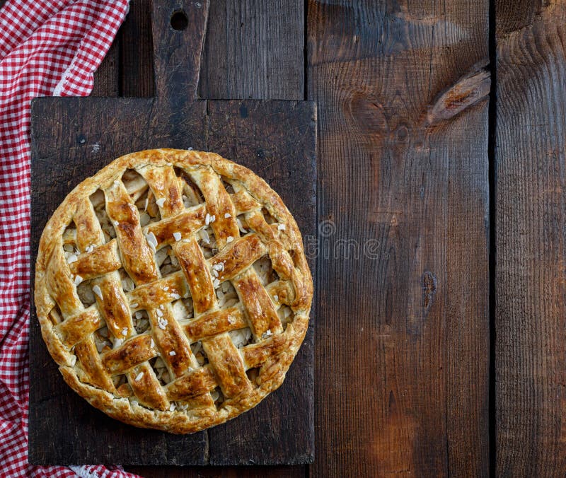 Baked Whole Round Apple Pie on a Rectangular Old Brown Board Stock ...