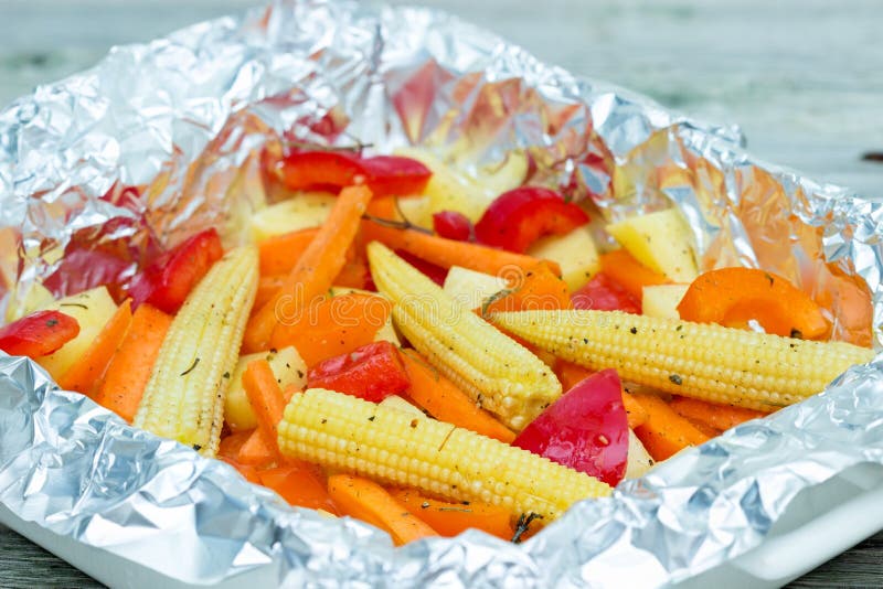 Baked Young Baby Corn and Vegetables in Foil Stock Photo - Image of ...