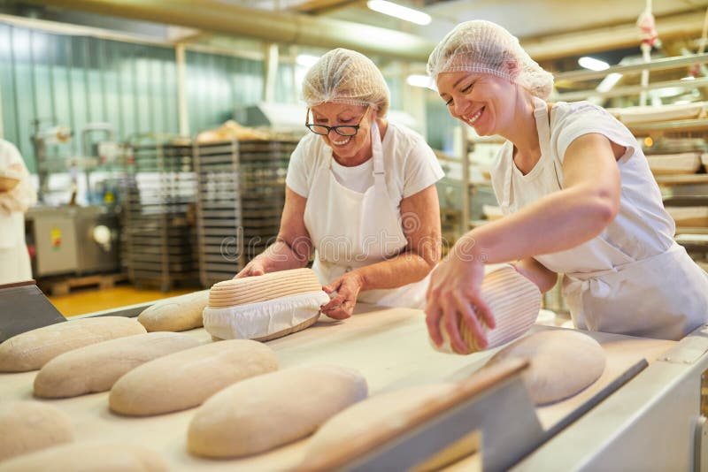 Baker Apprentice with Boss Baking Bread Under Guidance Stock Photo ...