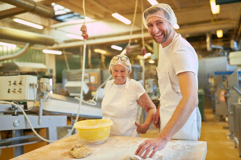 Baker Apprentice in Training and Senior Baker Stock Image - Image of ...