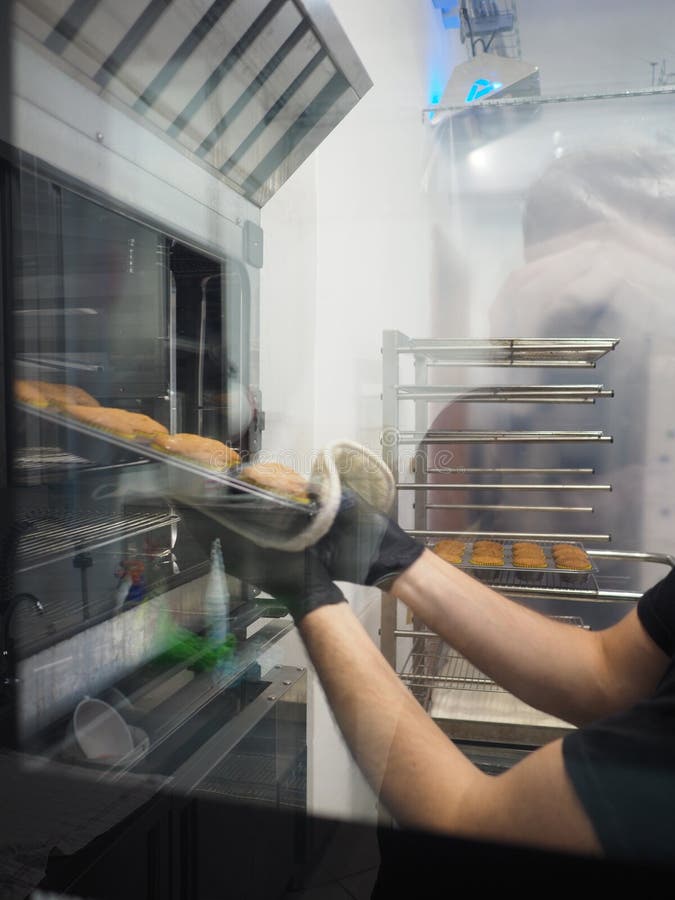 Baking a Large Group of Cookies in a Professional Oven in a Cake Lab ...
