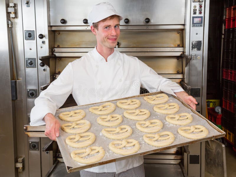 Baker with Baking Plate Full of Pastry in Bakery Stock Image - Image of ...