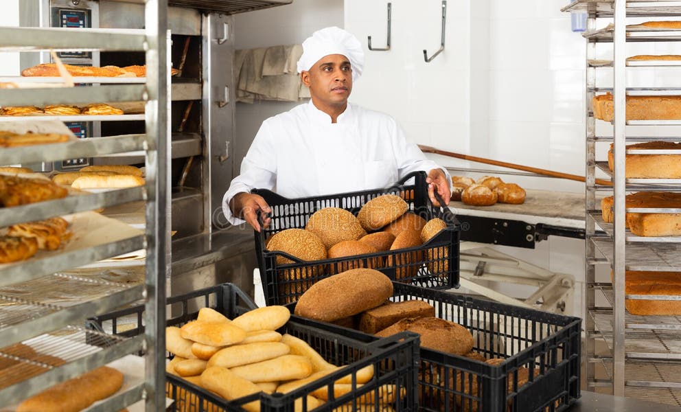 Baker with Box with Baguettes in Bakery Stock Image - Image of indoors ...