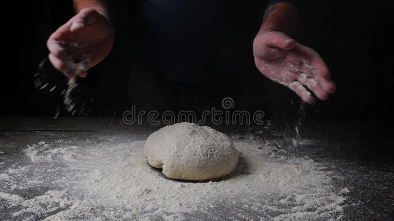 Baker Clapping His Hands Filled with Flour and Flours Fly. Dough on the ...