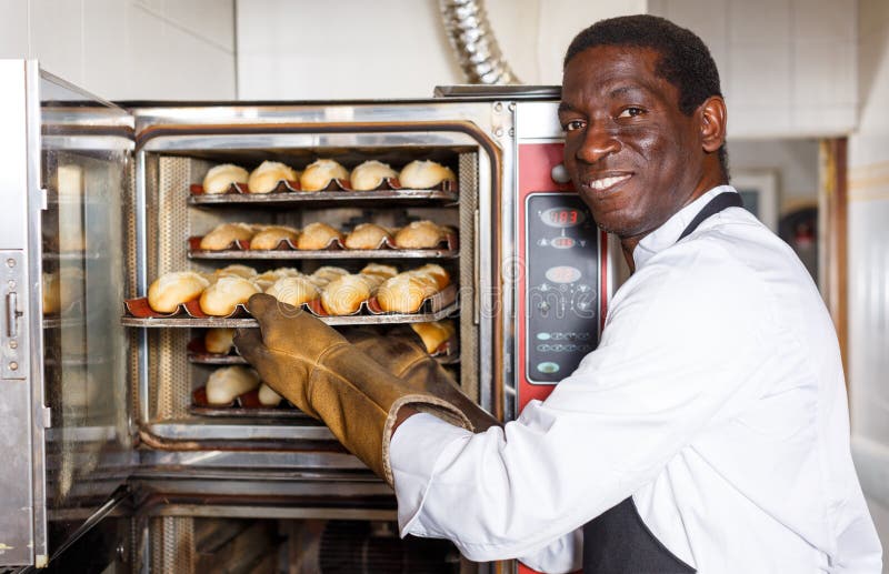 Baker Controlling Process of Baking Bread in Oven Stock Image - Image ...