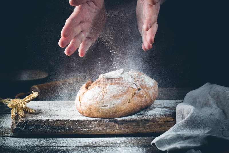 Baker cooking bread. stock image. Image of cook, flour - 145670333