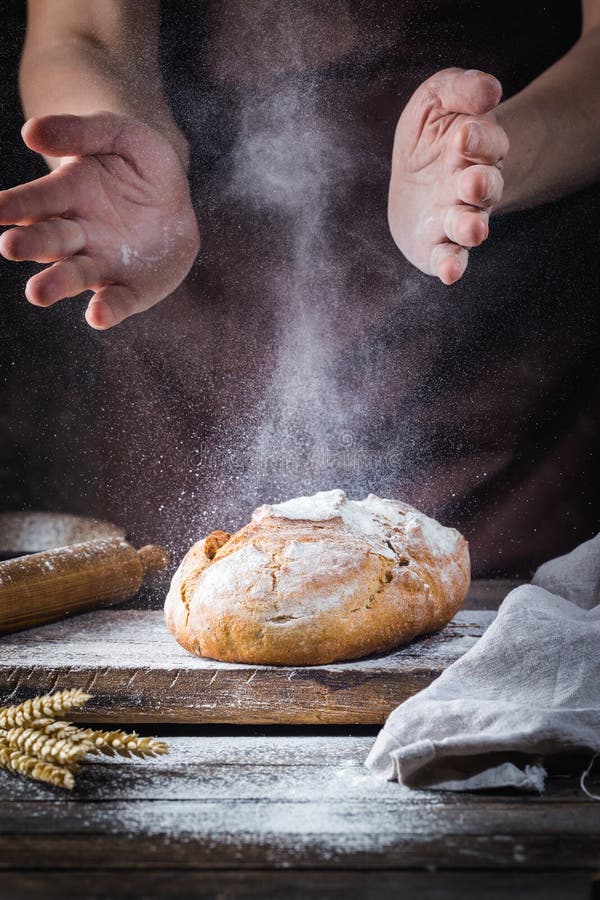 Baker cooking bread. stock image. Image of food, bake - 145670685