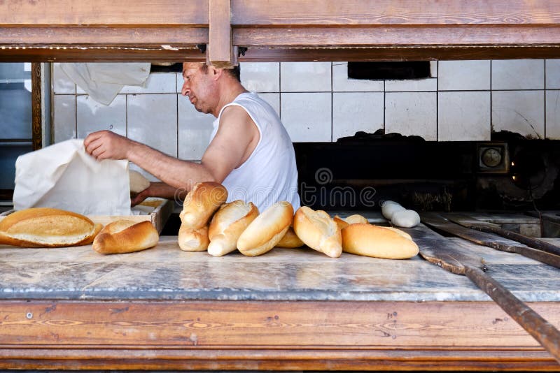 Baker Cooking Bread at a Traditional Bakehouse Stock Image - Image of ...