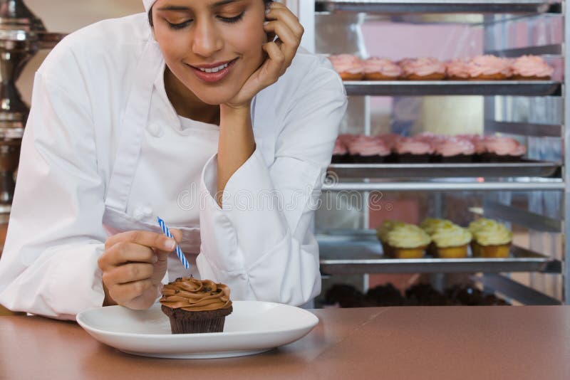 Baker with cupcake stock image. Image of happiness, kitchen - 62806735