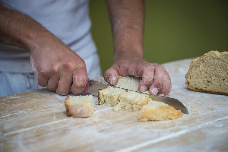 Baker Cutting Bread on the Table Stock Photo - Image of hands ...