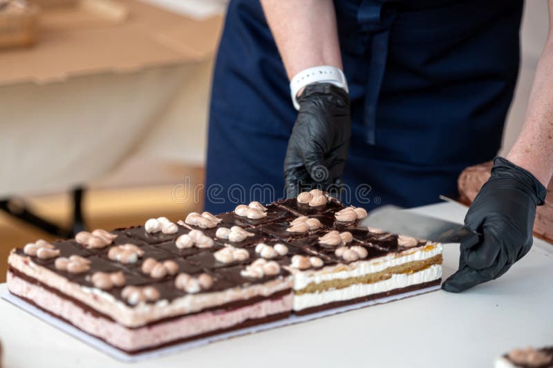 Baker Cutting Chocolate Cake with White Icing Stock Image - Image of ...