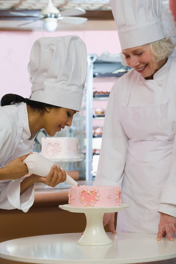 Baker decorating cake stock photo. Image of heart, decorating - 62806738