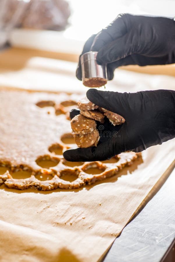 Baker forms round biscuits stock photo. Image of brown - 211818680