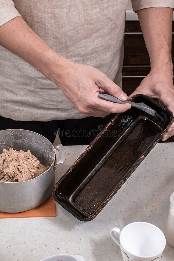 Baker Greases a Bread Baking Dish. Stock Image - Image of bakery, baker ...