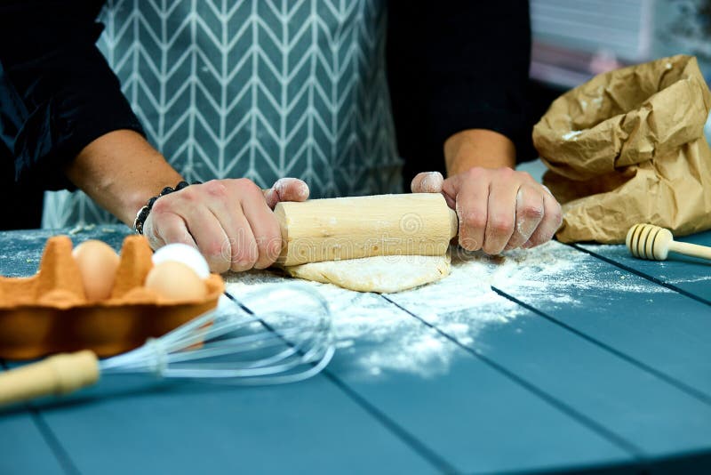 Baker Hands Preparing Fresh Dough with Rolling Pin on Kitchen Table ...