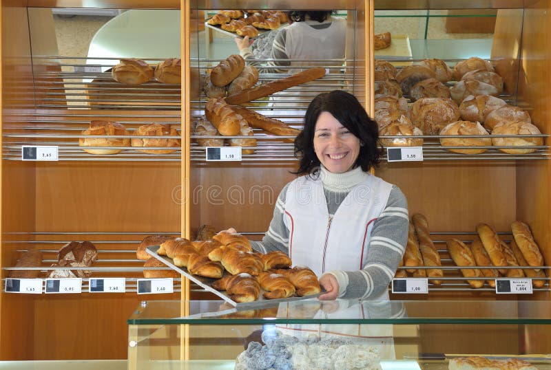 Baker in her bakery stock image. Image of owner, employee - 121624093