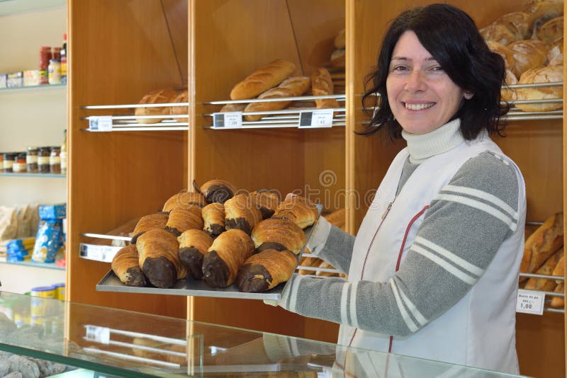 A baker in her bakery stock image. Image of industry - 121624127