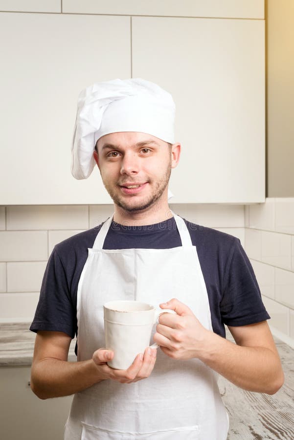Baker hold a cup and stock image. Image of enjoyment - 113322221
